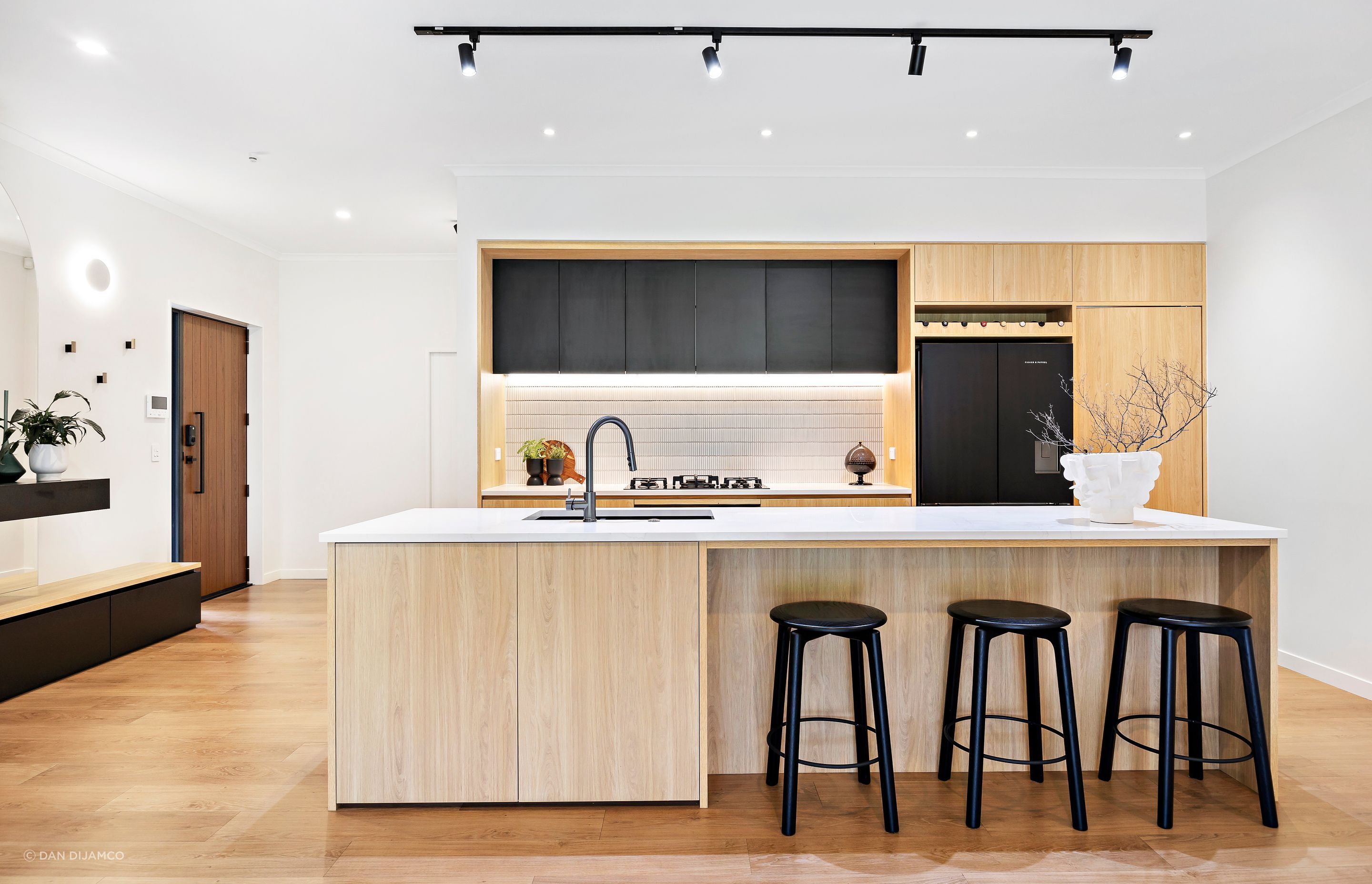 Oak + Black Melamine with Pocket Door by Fluid Interiors | ArchiPro NZ