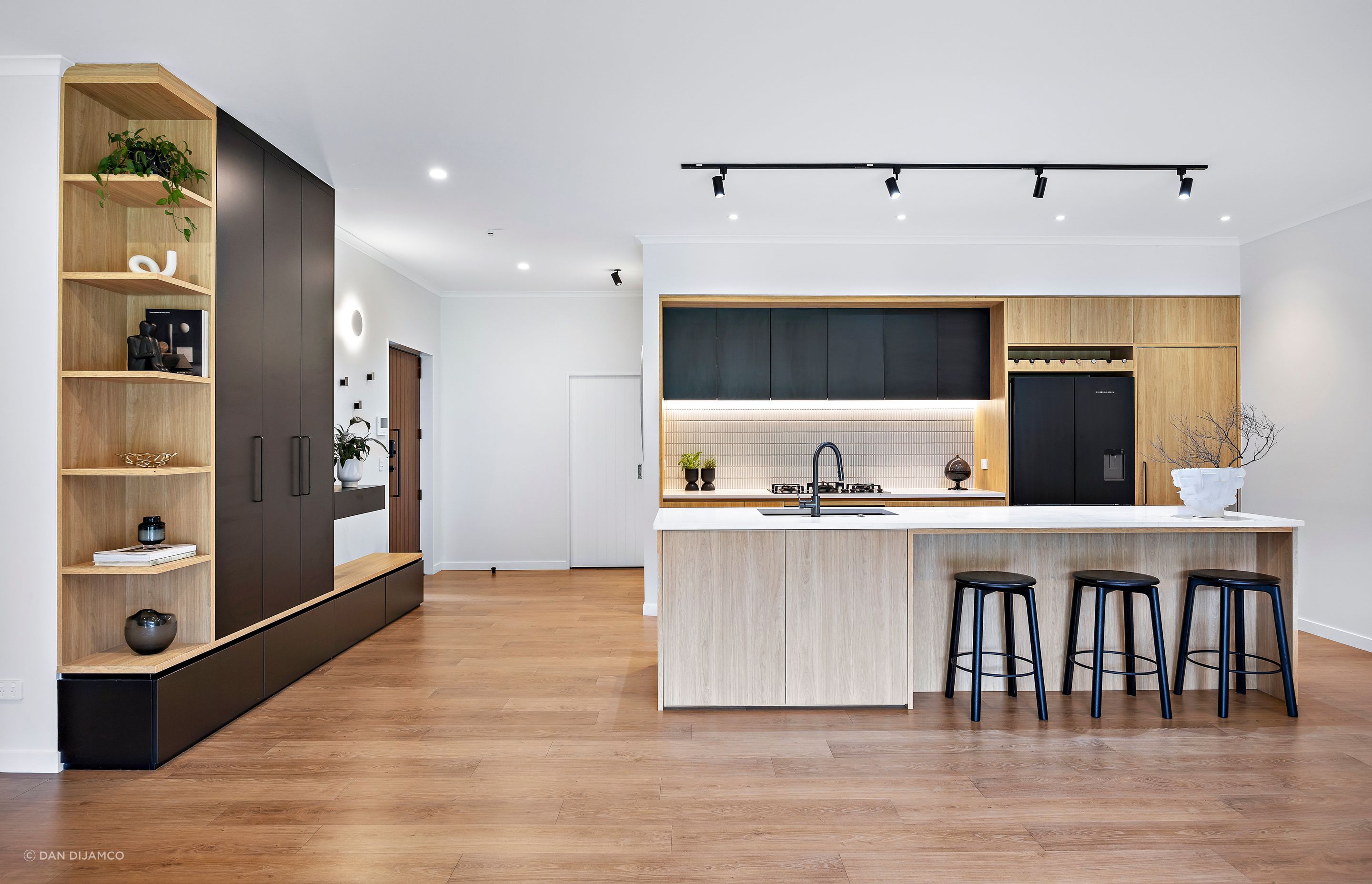 Oak + Black Melamine with Pocket Door by Fluid Interiors | ArchiPro NZ