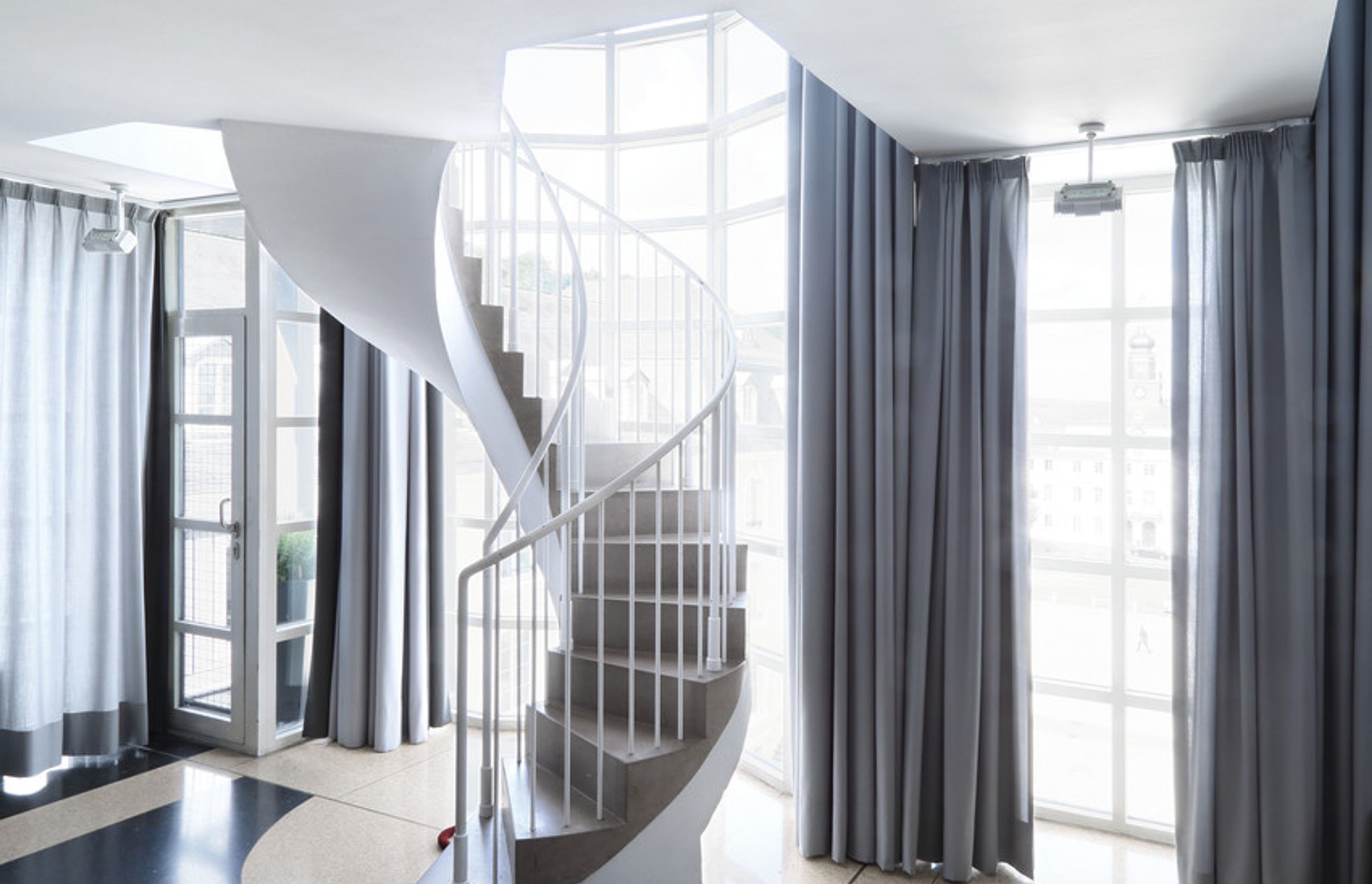 The architects of silence: floating, automated curtains Artisan