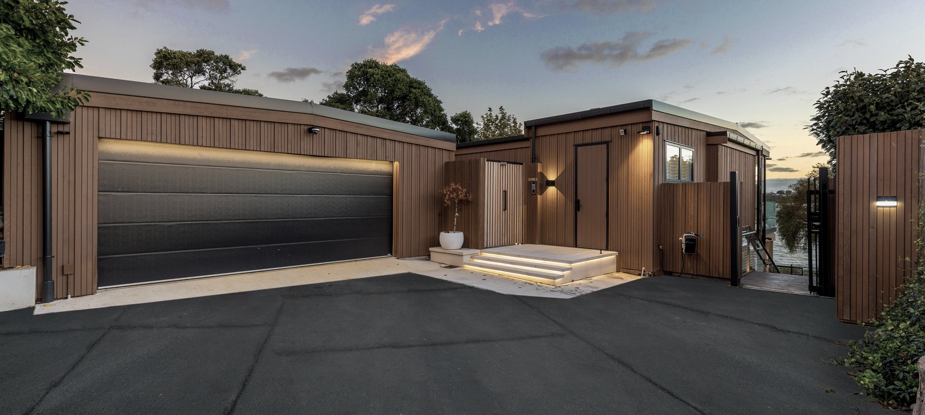Meet the builders behind this cedar-clad home on the shores of Lake Pupuke