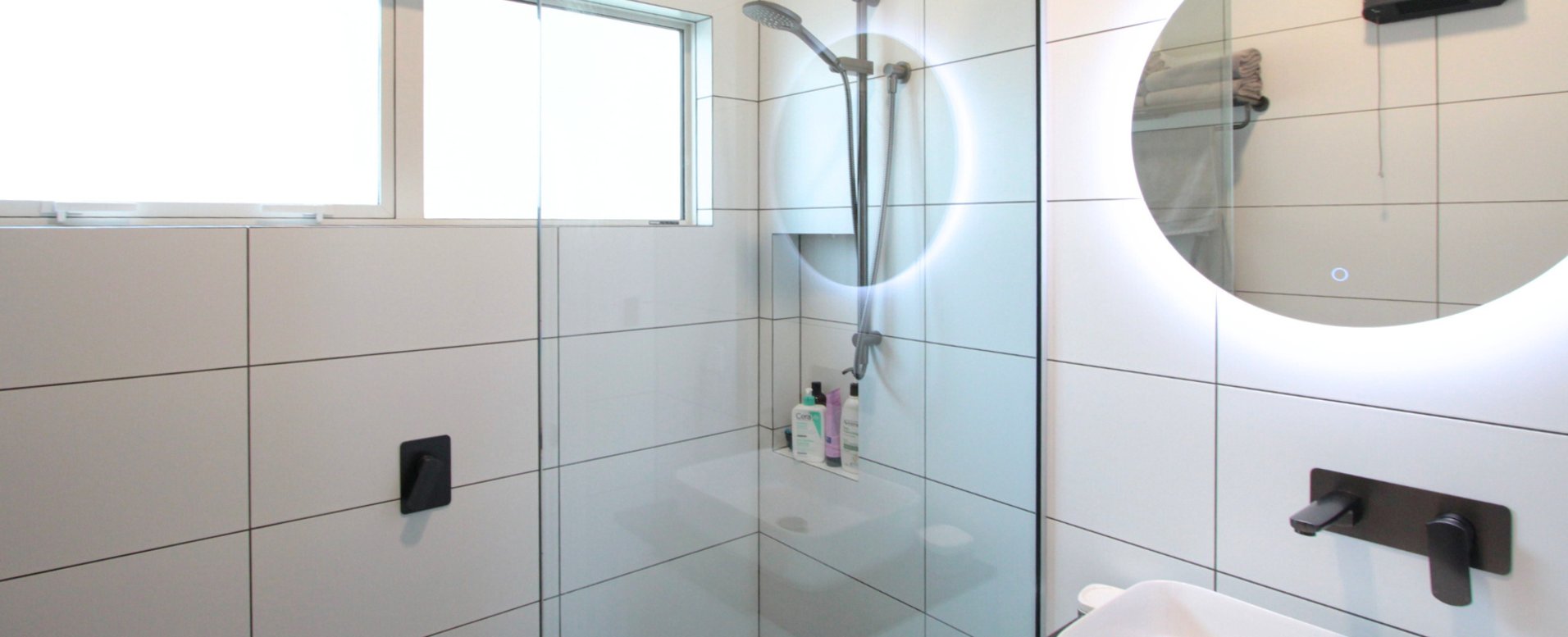 Sleek Bathroom Makeover by Reno Masters | ArchiPro NZ