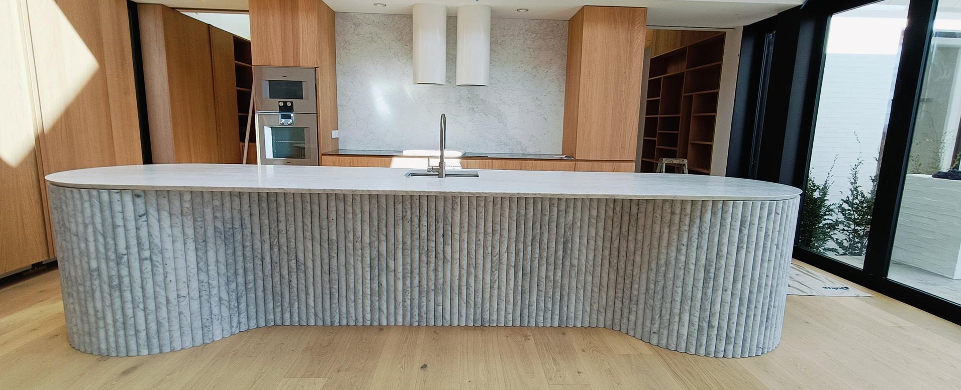 Damn Good Tiling - kitchen island flute marble tile by Damn Good Tiling ...