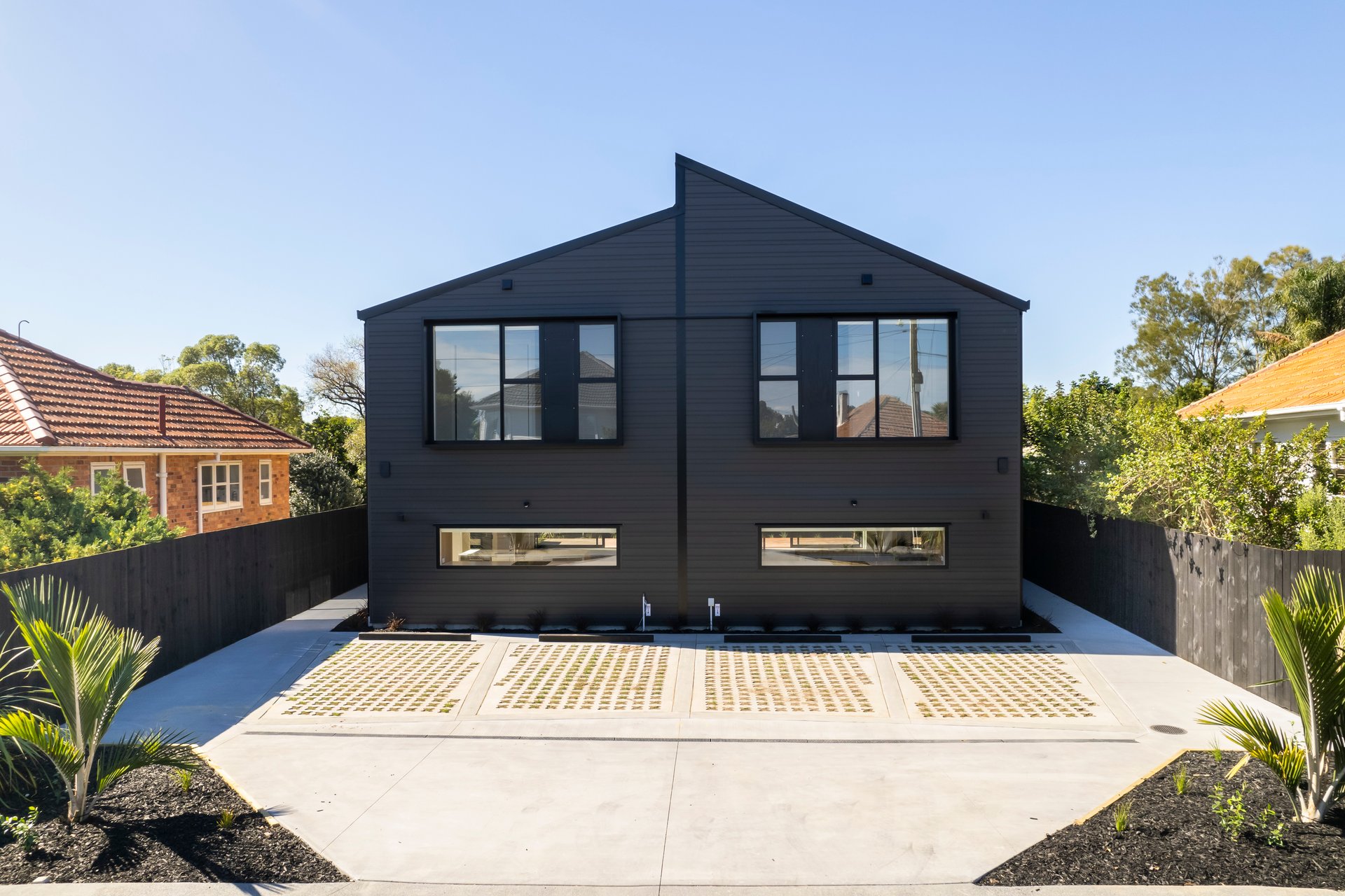 Simple and Sleek Duplex by Maddren Homes | ArchiPro NZ