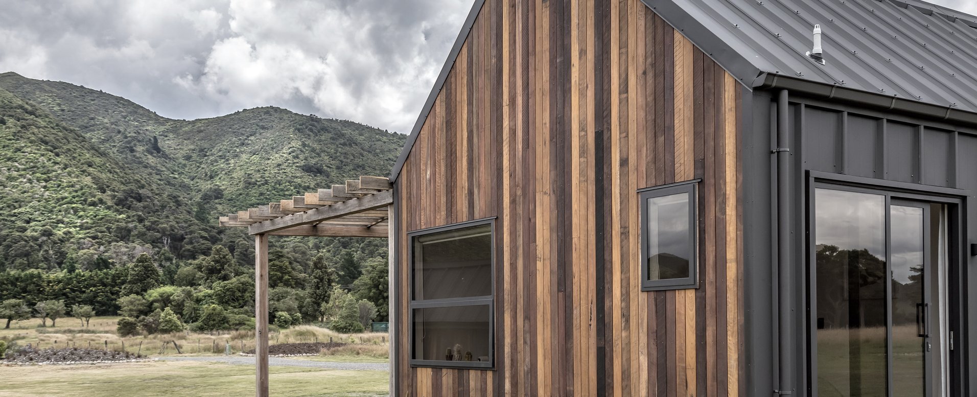 Kāhu Cottage by Hardwood Timbers NZ | ArchiPro NZ
